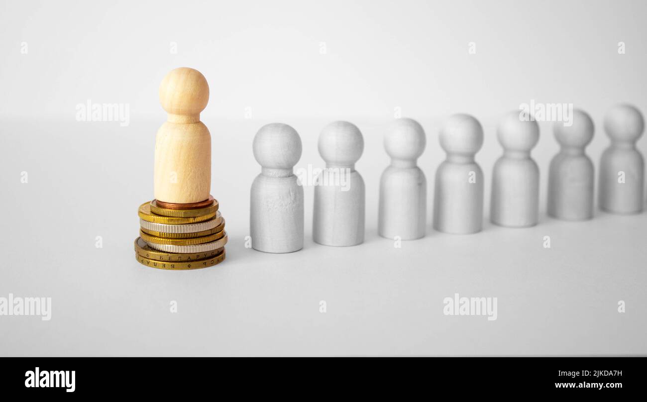 Miniature people: Small figures standing on stack of coin. Money and ...