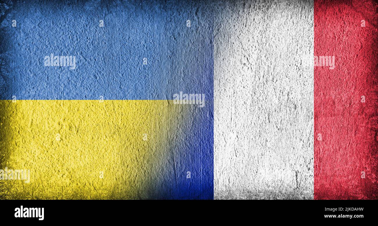 Ukrainian and French flag on concrete, divided in the middle Stock ...