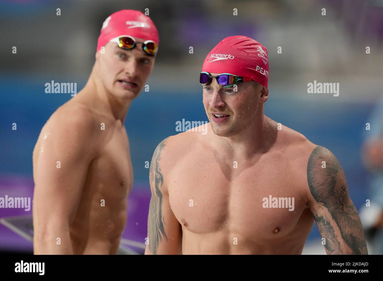 England’s Adam Peaty and England’s James Wilby look on after the Men’s ...
