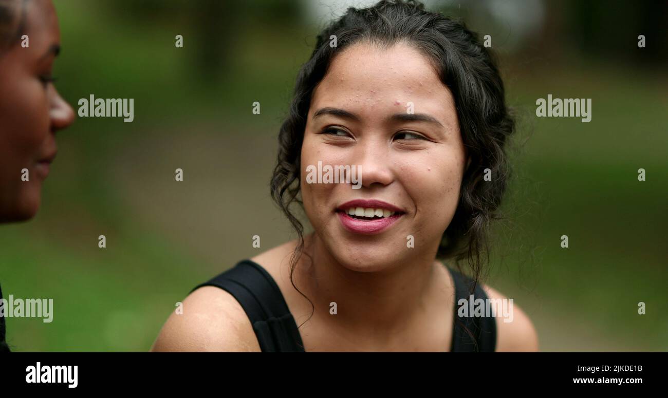Two diverse friends laughing and smiling together. Mixed race ...