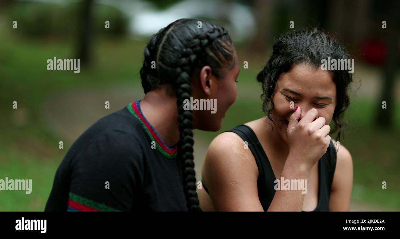 Two diverse friends laughing and smiling together. Mixed race ...