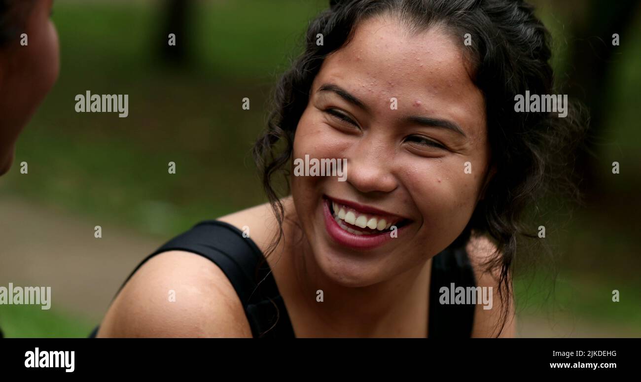 Two friends real life laugh and smile together outdoors Stock Photo - Alamy