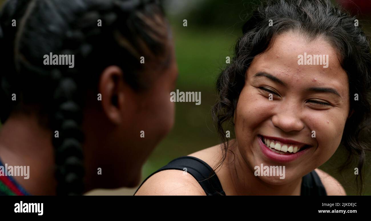 Two friends real life laugh and smile together outdoors Stock Photo - Alamy