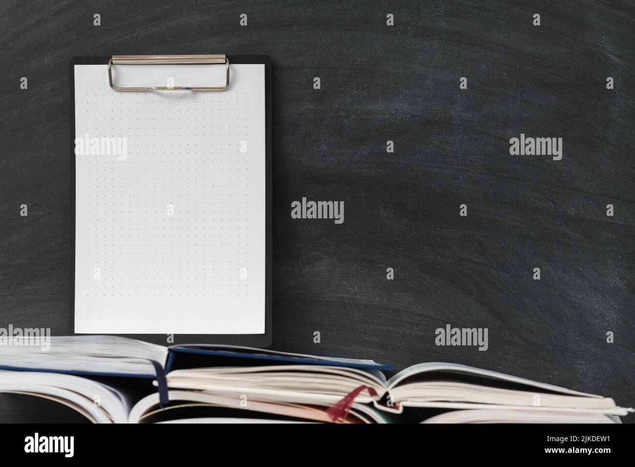knowledge concept mockup clipboard book chalkboard Stock Photo - Alamy