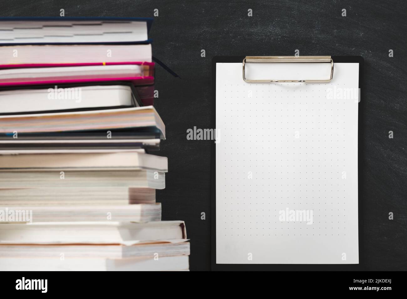 education book stack mockup clipboard chalkboard Stock Photo - Alamy