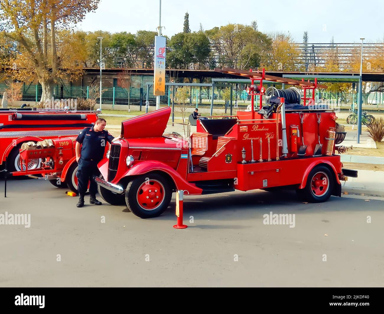 Shot of an old red 1936 Ford model 51 V8 fire truck pumper tanker. Side ...