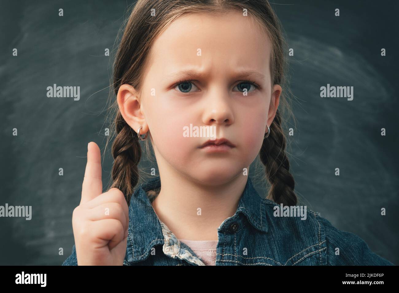 back to school warning young girl chalkboard Stock Photo - Alamy