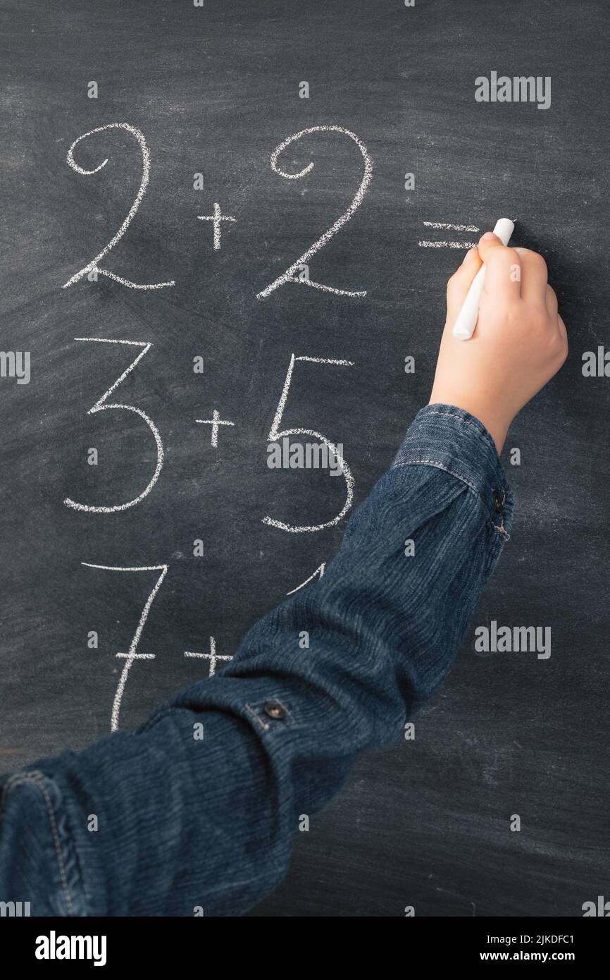 school studying mathematics kid do sum chalkboard Stock Photo - Alamy
