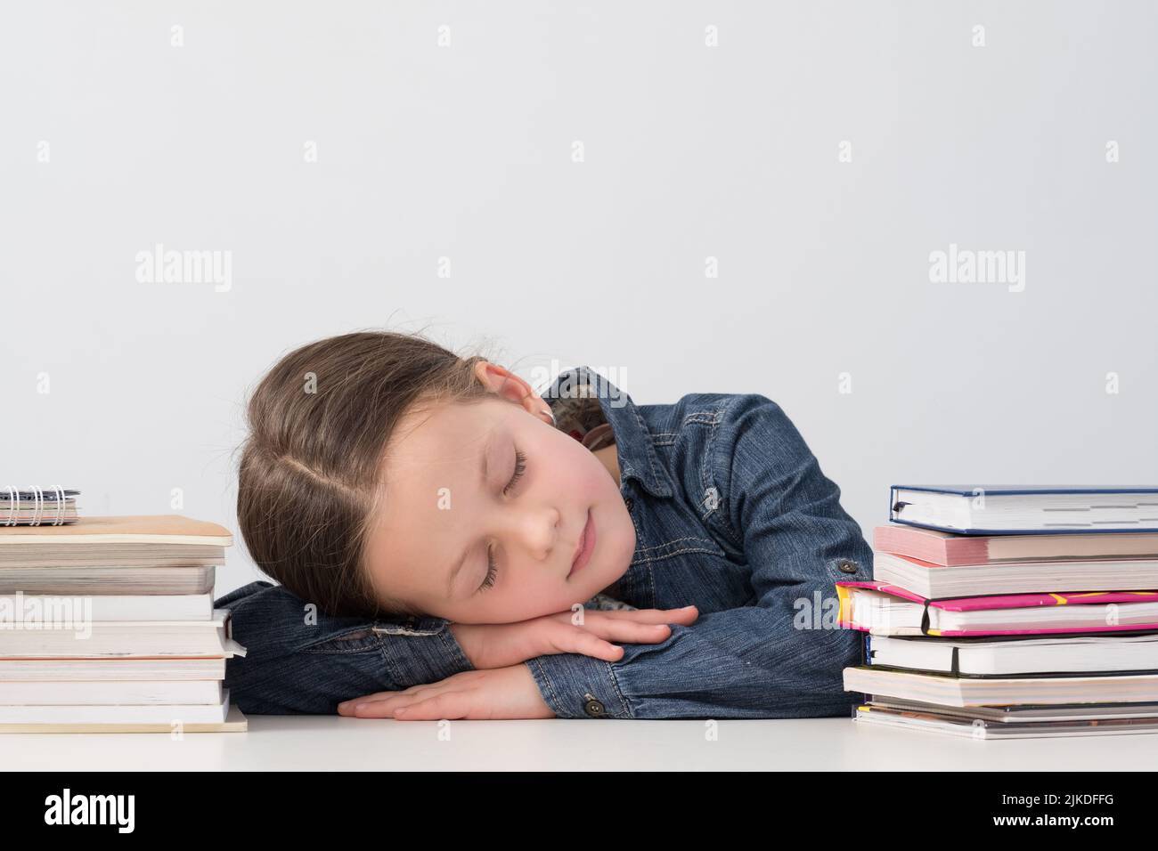 school girl lifestyle kid sleeping book stacks Stock Photo - Alamy