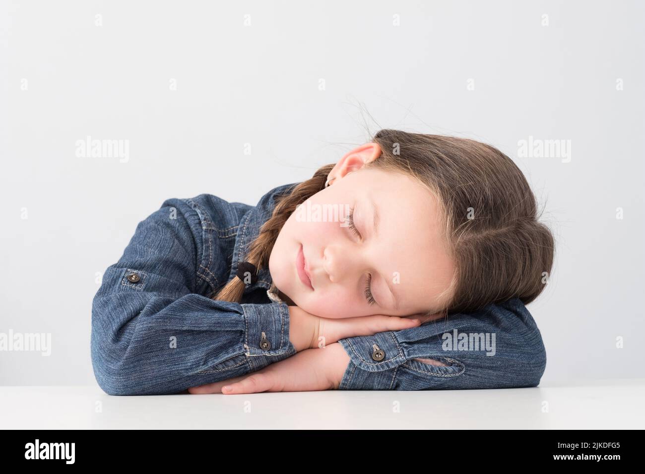Kids asleep at table hi-res stock photography and images - Alamy