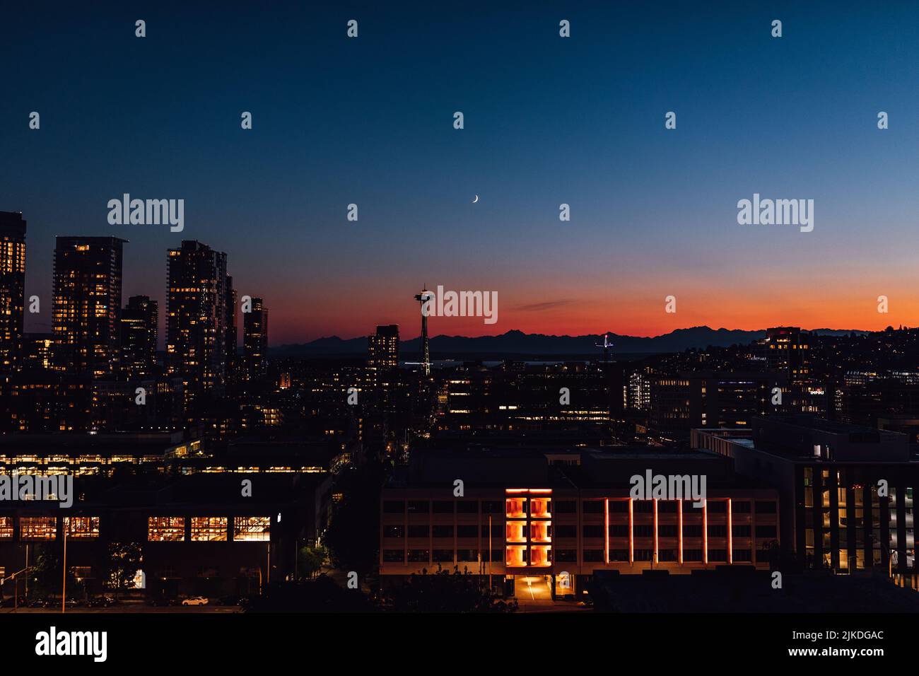 sunset with downtown Seattle skyline, Olympic Mountains, crescent moon ...