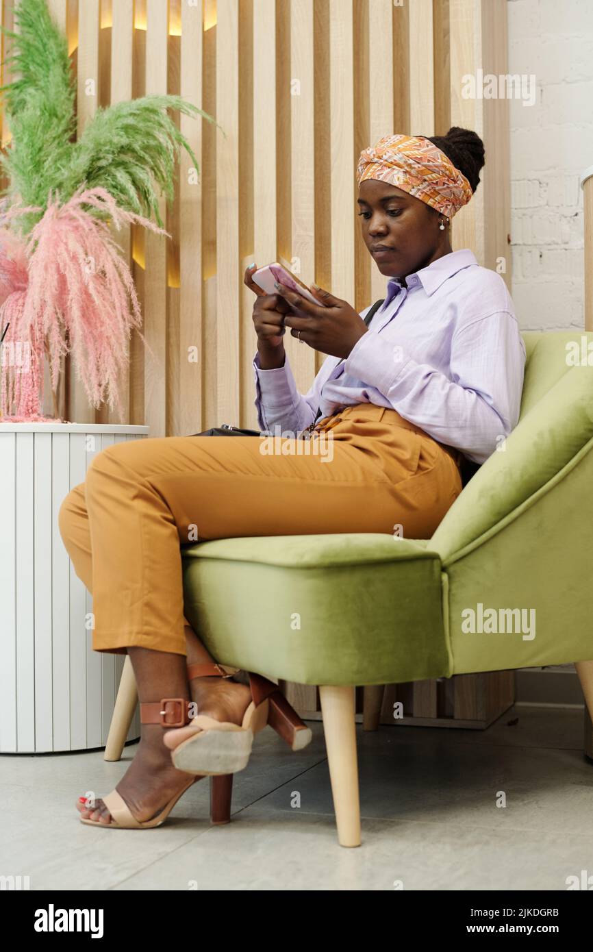 Young African American female client of boutique or beauty salon ...