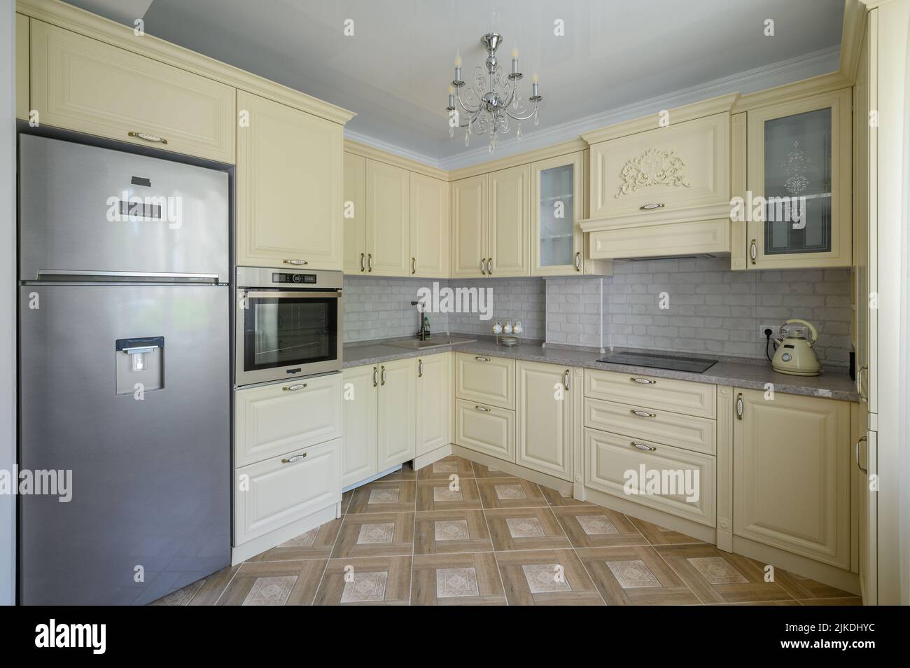 Interior of modern trendy cream colored kitchen Stock Photo - Alamy