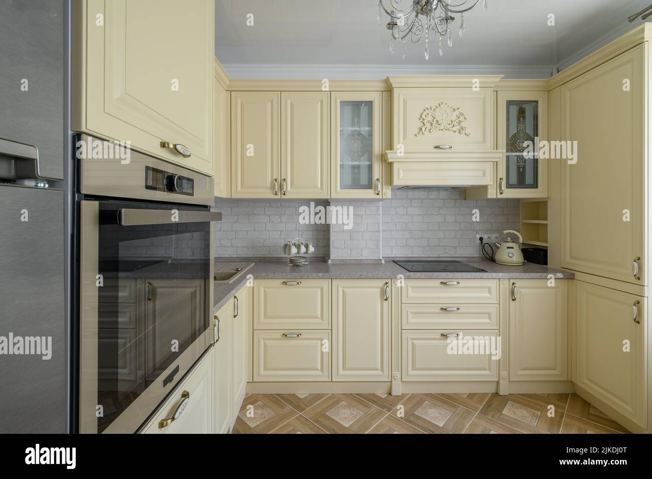 Interior of modern trendy cream colored kitchen Stock Photo - Alamy