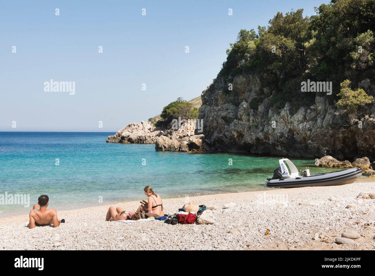 Sunbathing on the beach of Brisana, Peninsula of Karaburun, within the ...