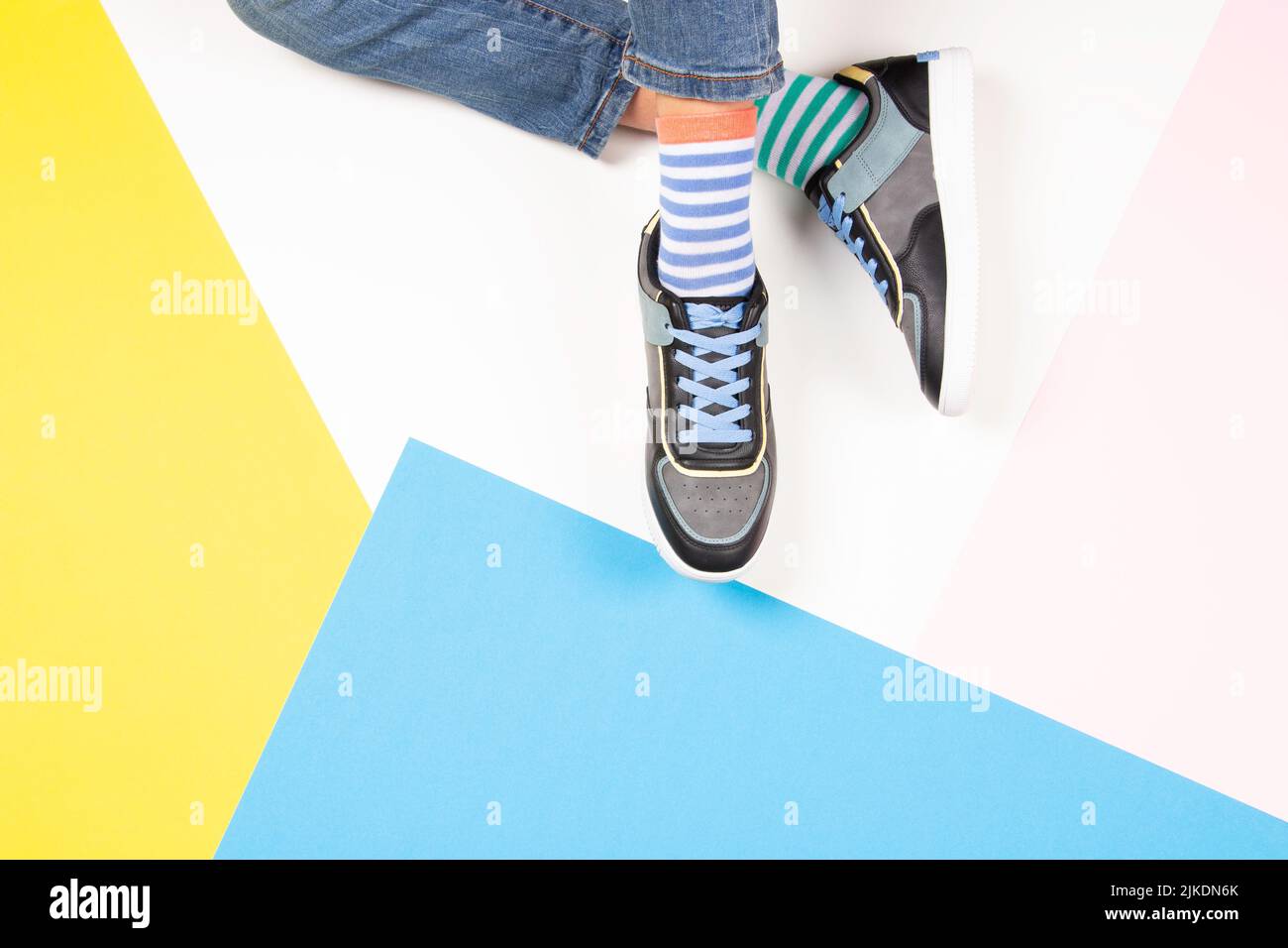 Kid wearing different pair of socks. Child foots in mismatched socks ...