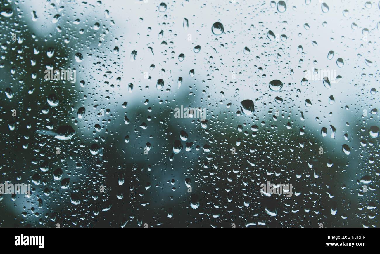 Sun after rain. Drops on glass. It's been raining. Texture on glass ...
