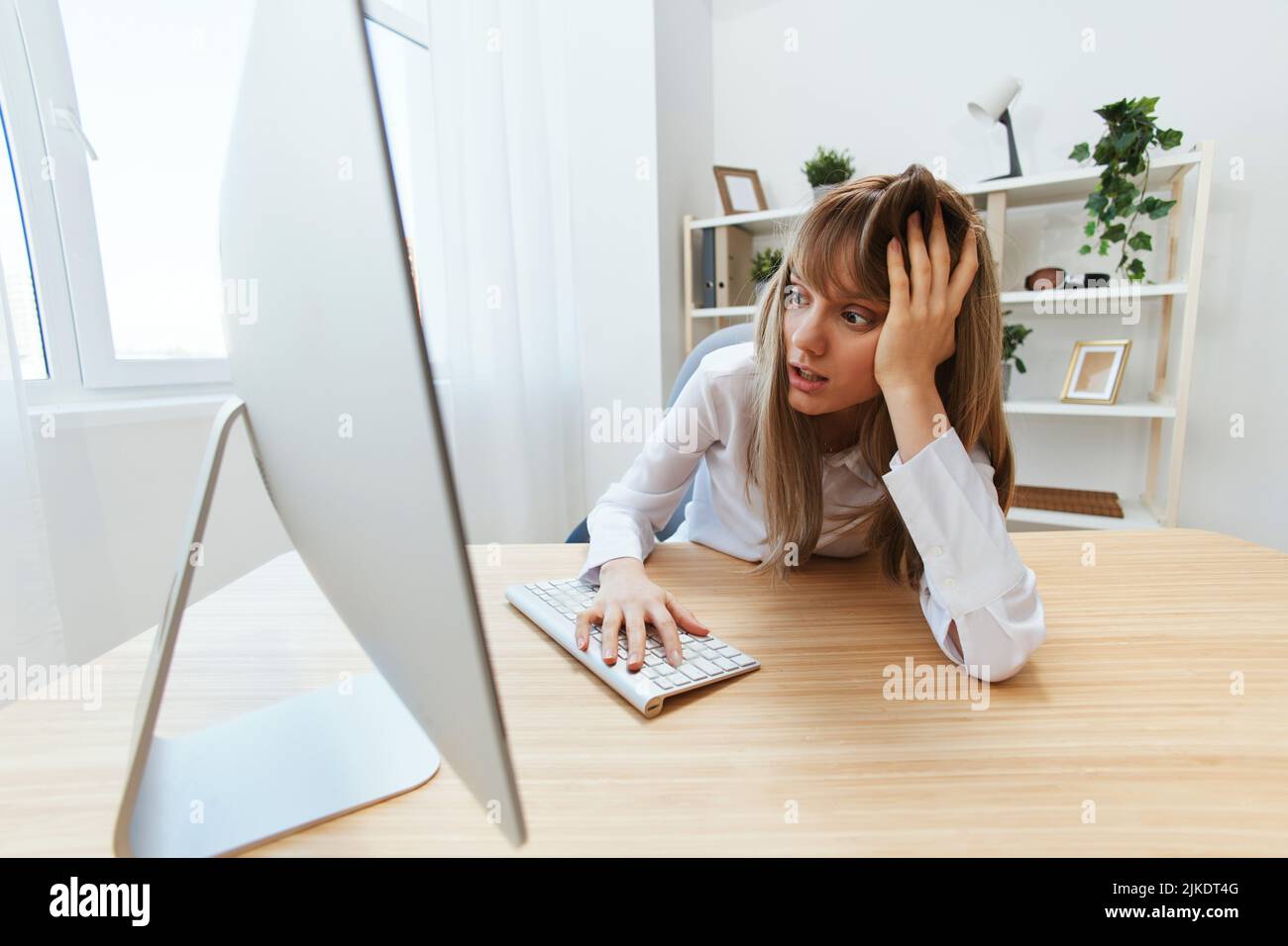 Shocked blonde businesswoman made big mistake in report look at screen ...