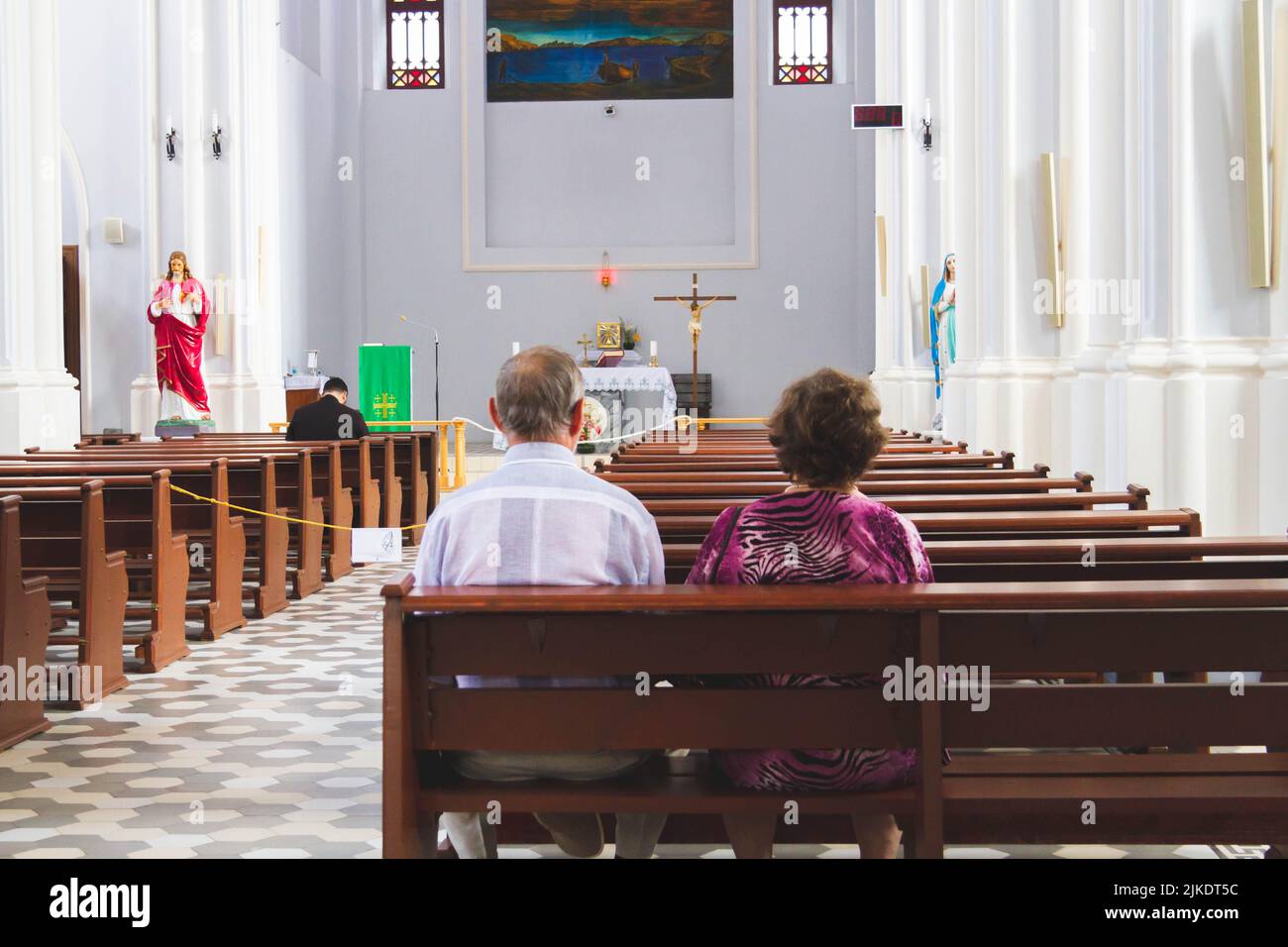 People pray in the church. Church parish. Believers sit on benches in ...