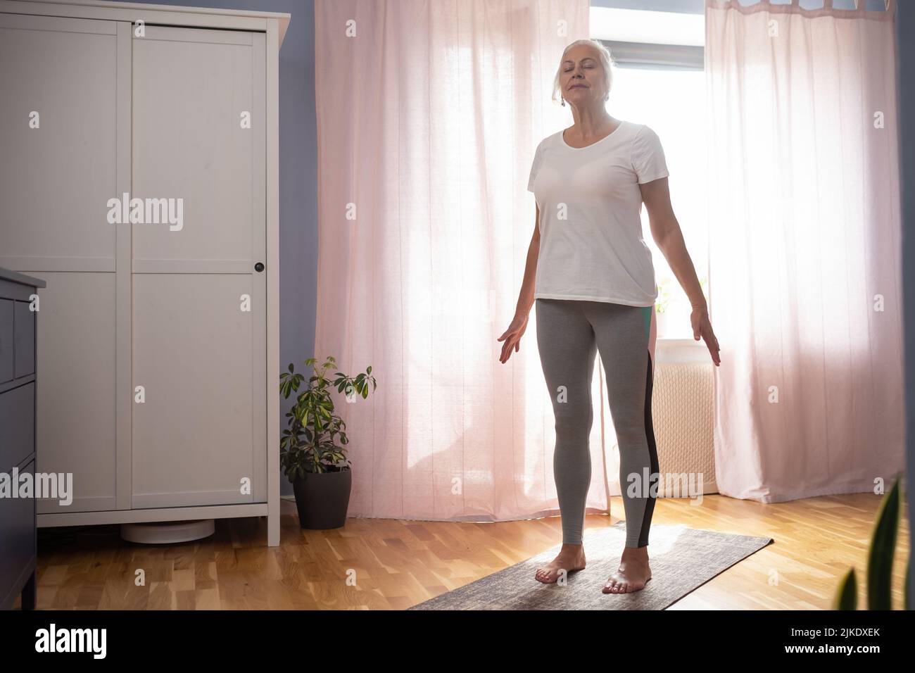 Woman in tadasana hi-res stock photography and images - Alamy