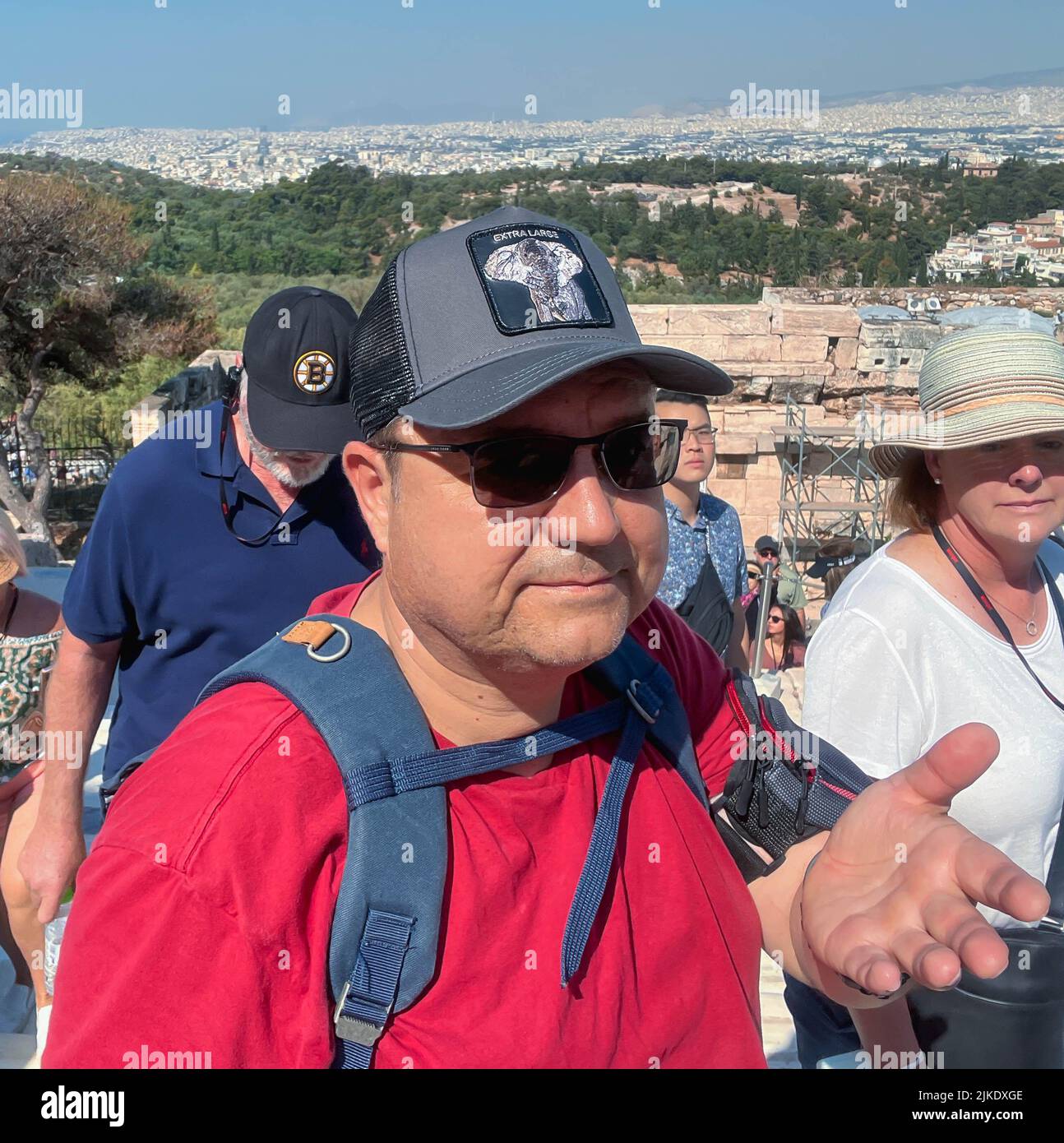 ATHENS, GREECE - MAY 14, 2022: A man in a baseball cap and a red T ...