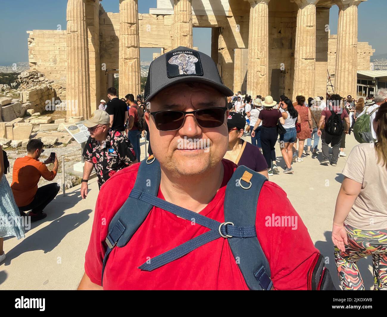 ATHENS, GREECE - MAY 14, 2022: A man in a baseball cap and a red T ...