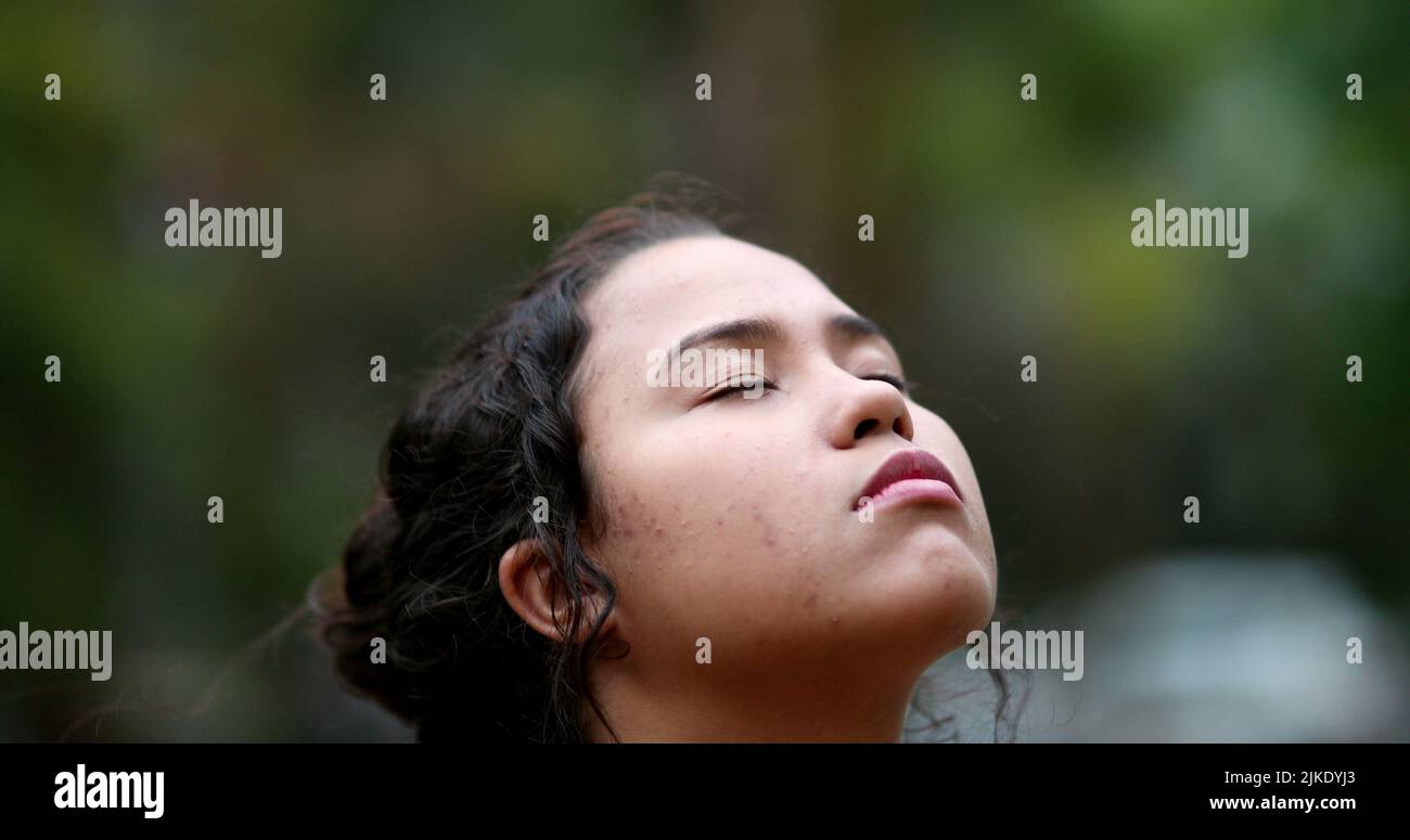 Young woman opening eyes and smiling, feeling happy and free Stock ...