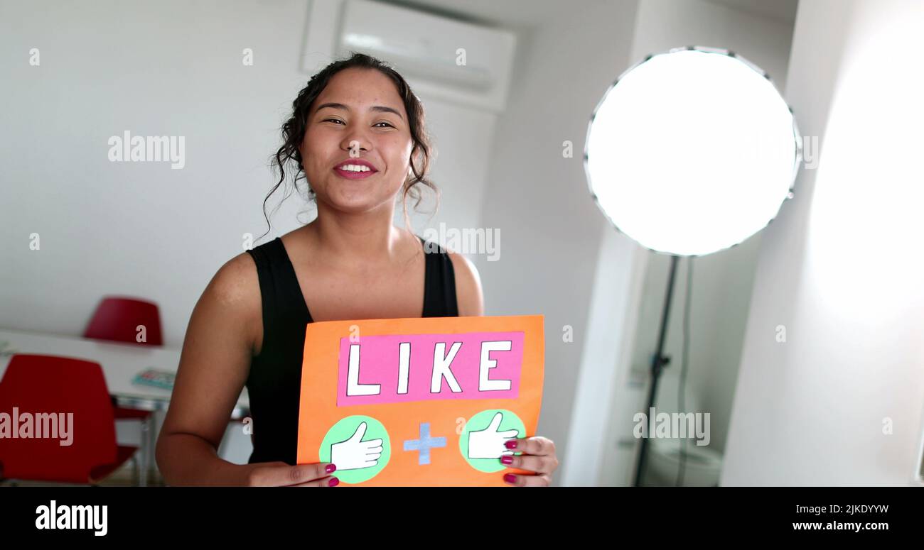 Young woman vlogging in front of camera tripod Stock Photo - Alamy