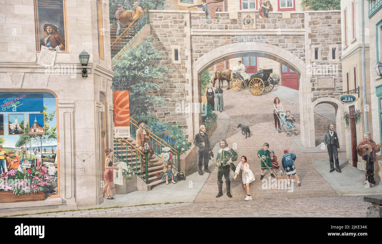 Teenage girl posing in front of a huge wall painting in Old Quebec City ...