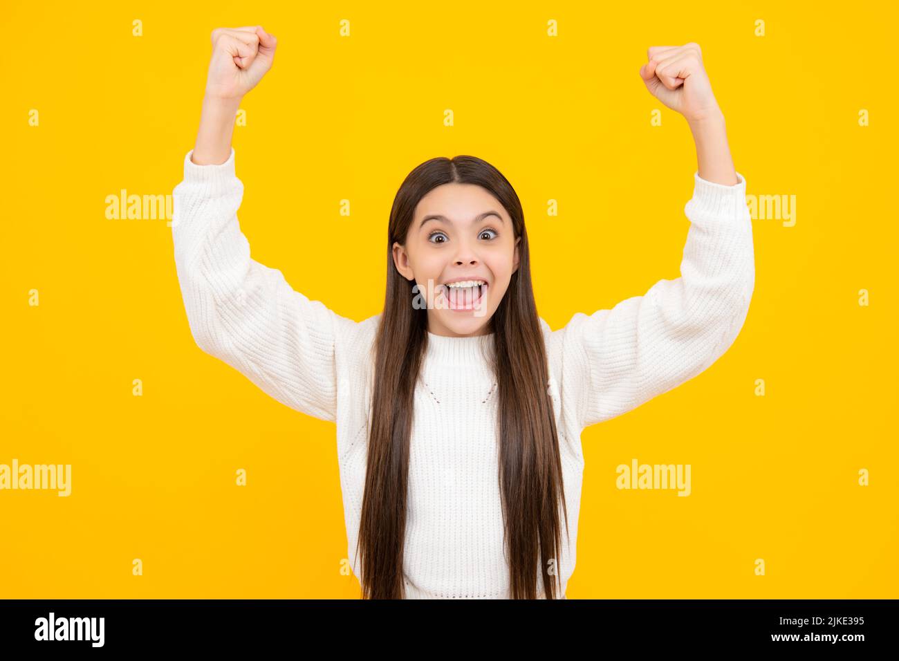 Child girl rejoicing, say yes, looking happy and celebrating victory ...