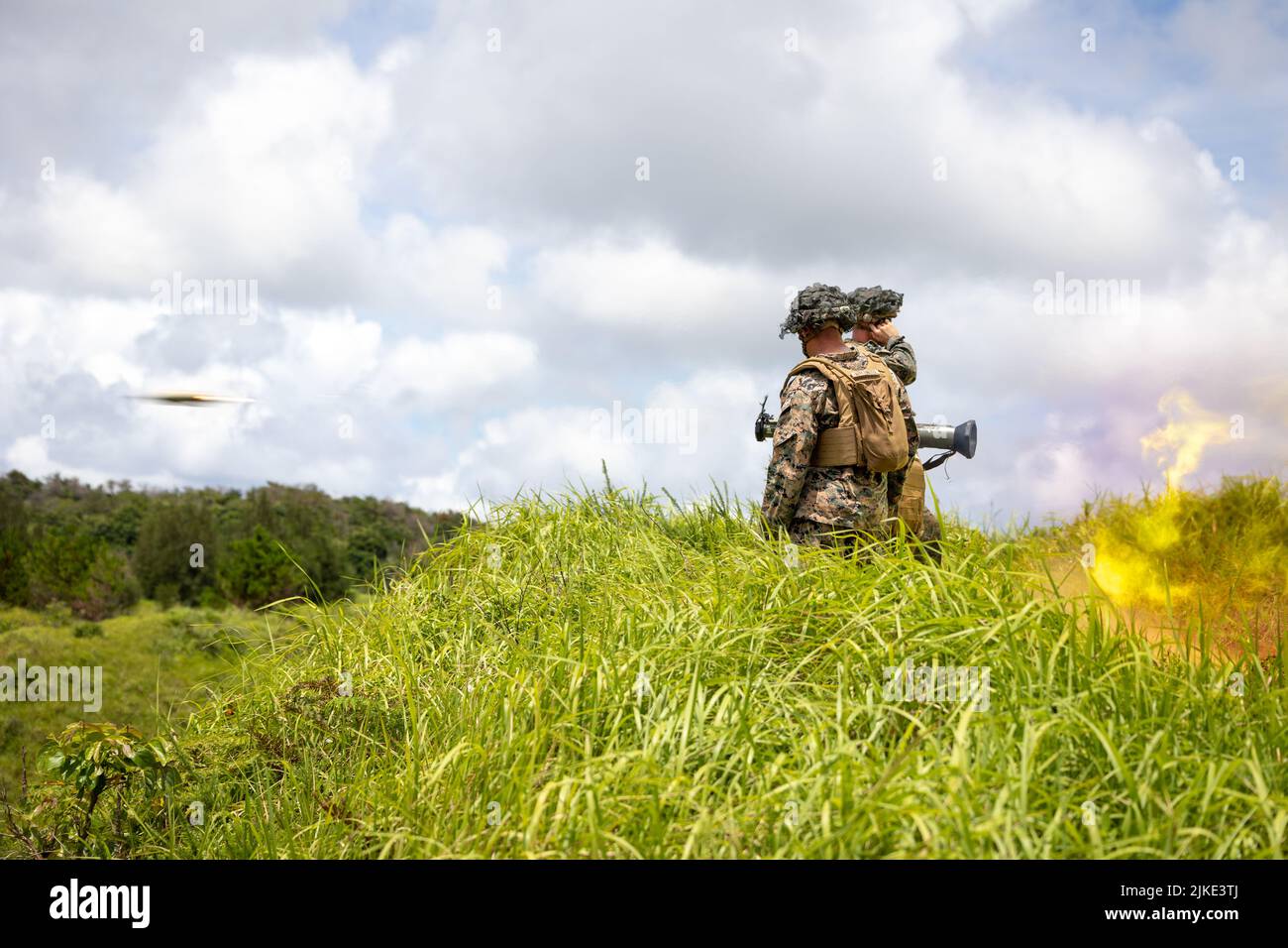 U.S. Marines with 3d Battalion, 3d Marines fire an M136 AT4 rocket ...