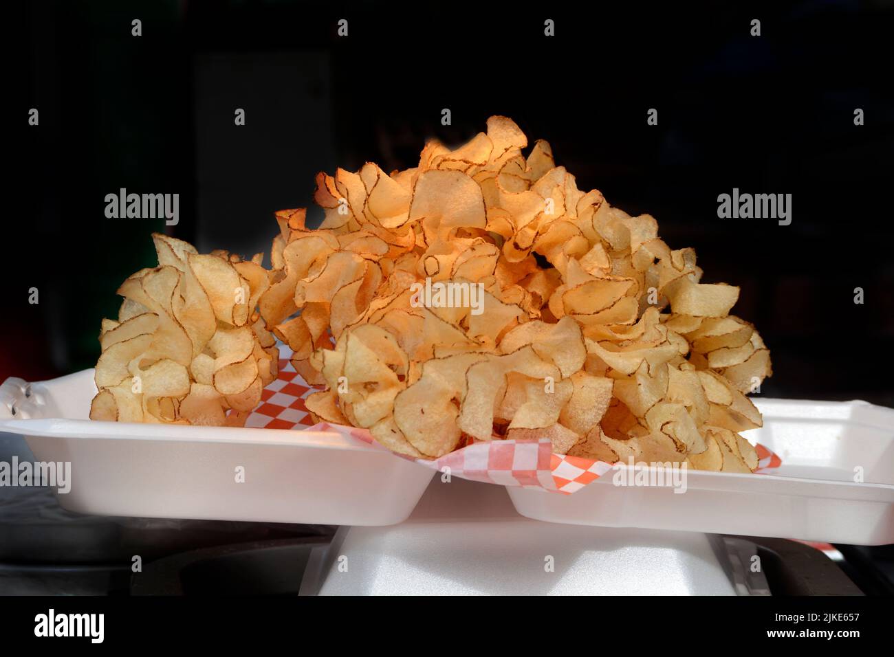 A plate of ribbon fries purchased from a food vendor at an outdoor ...