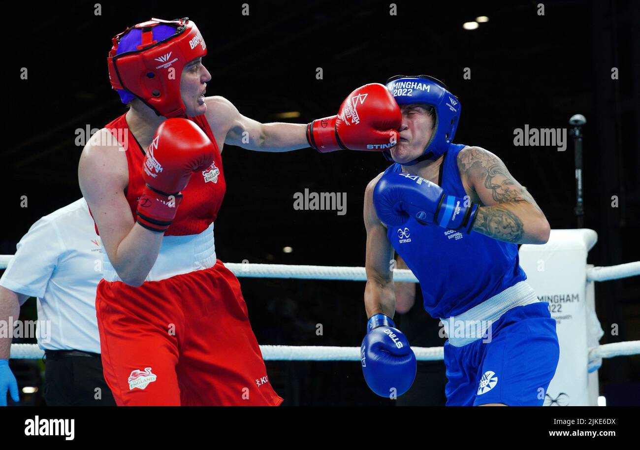 England's Gemma Paige Richardson (red) and Scotland's Megan Reid in the ...