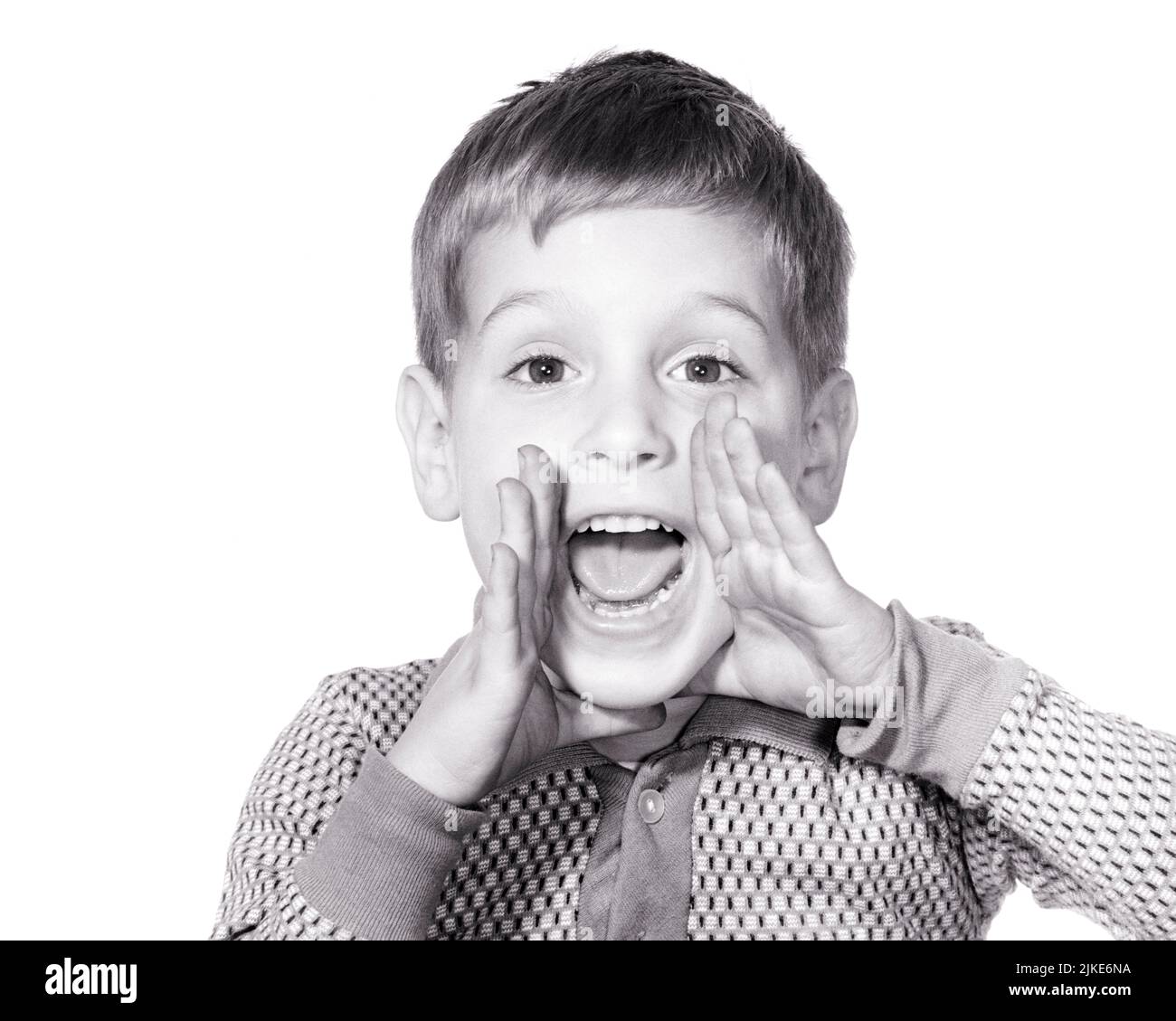 1960s LITTLE BOY SHOUTING YELLING HANDS CUPPED AROUND HIS MOUTH OPEN ...