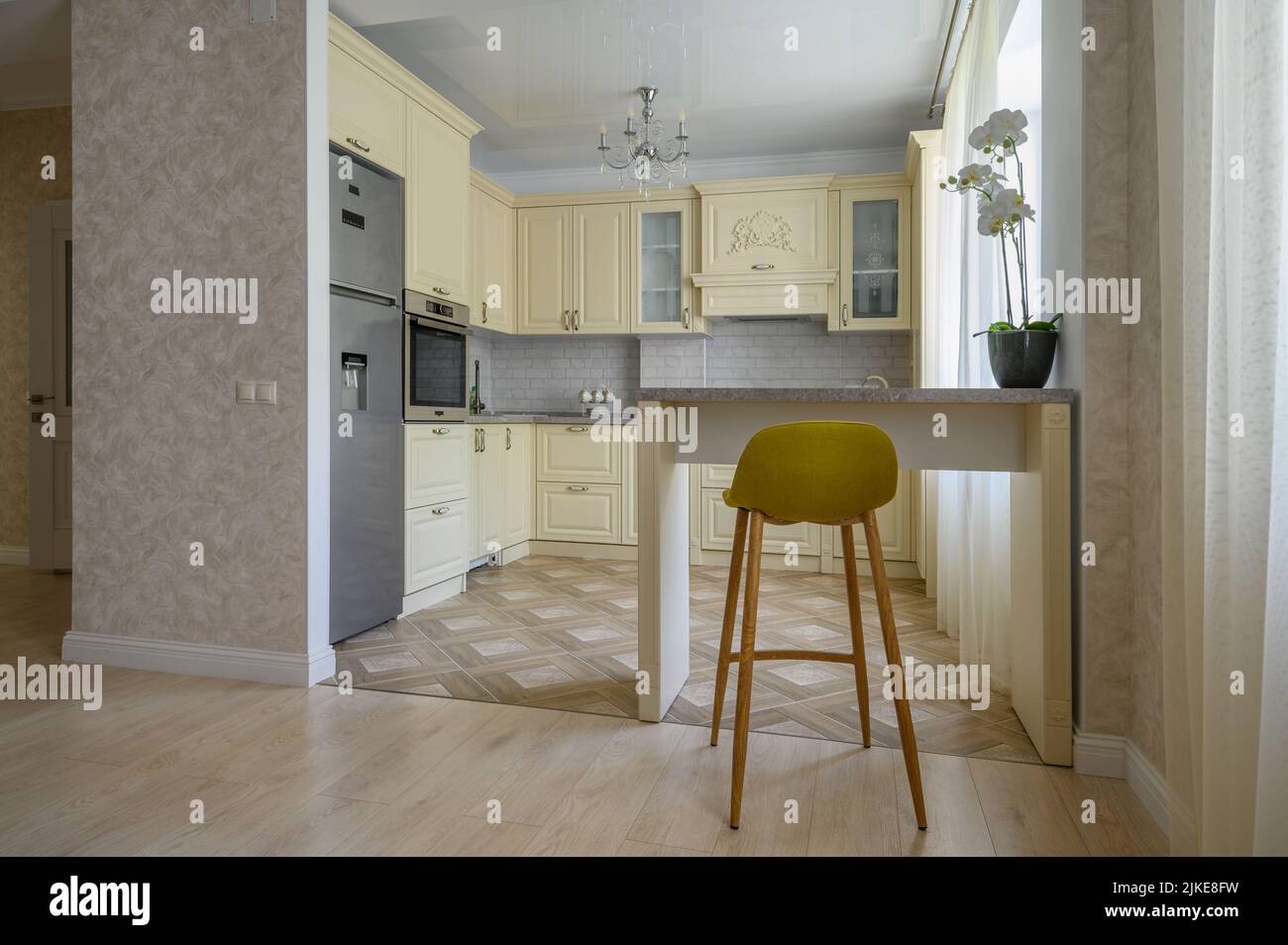 Interior of modern trendy cream colored kitchen Stock Photo - Alamy