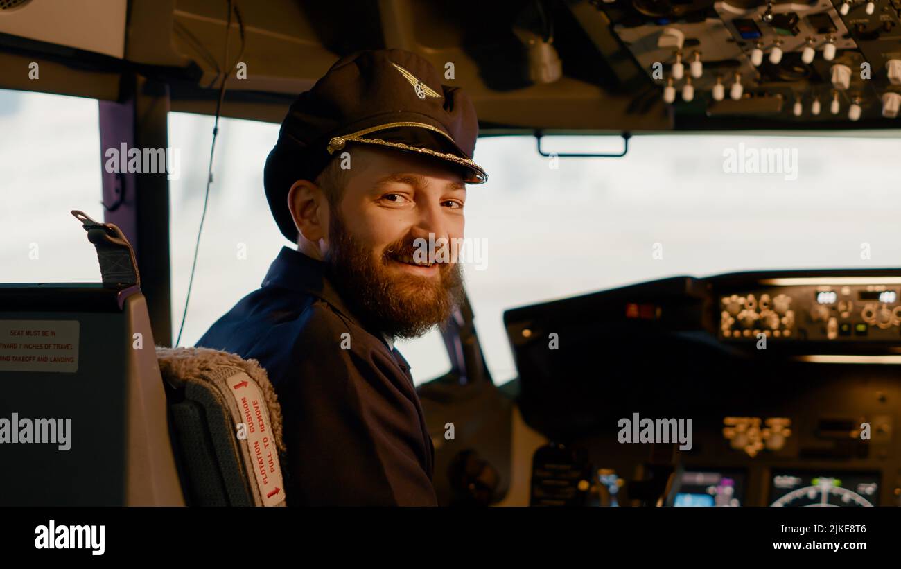 Portrait of airplane captain preparing to takeoff and fly using ...