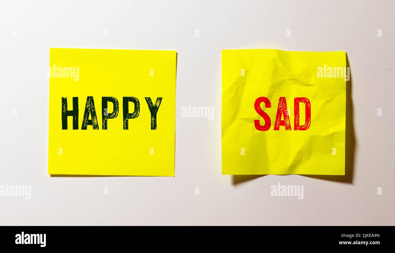 happy and sad word written on wood block. Top view concept. Isolated on ...