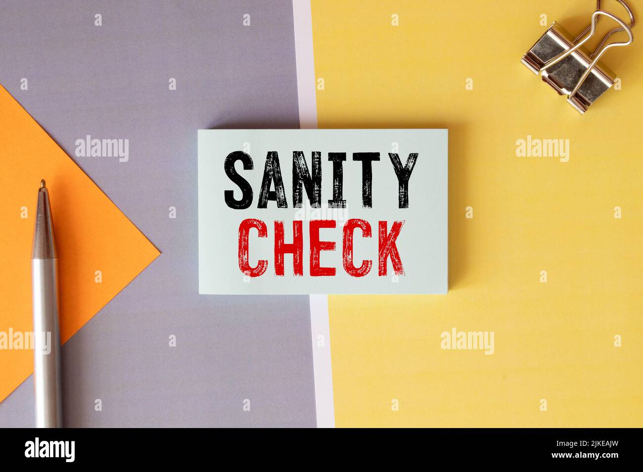 text Sanity check on white business card Stock Photo - Alamy