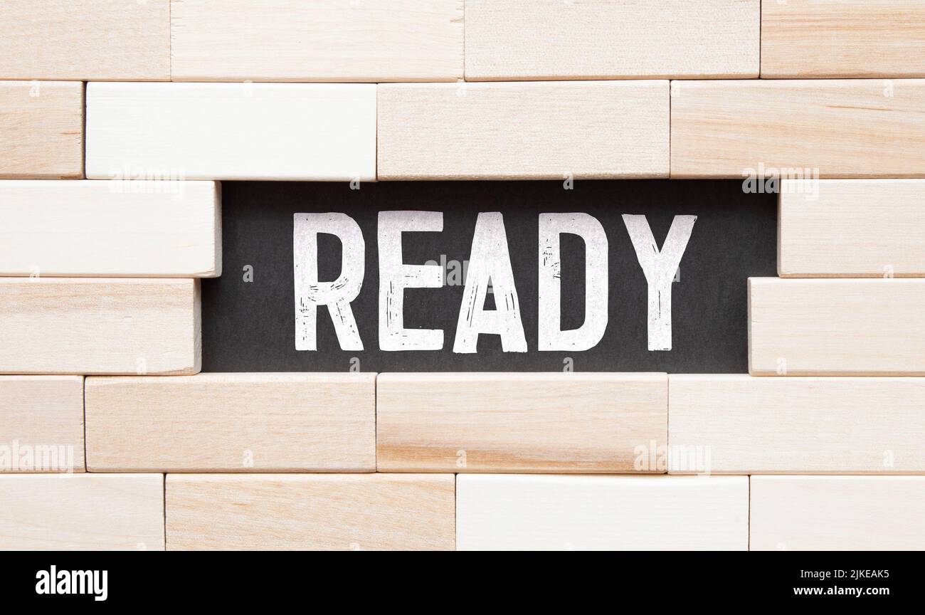 On a gray background, a bright yellow pencil and a yellow sticker with ...