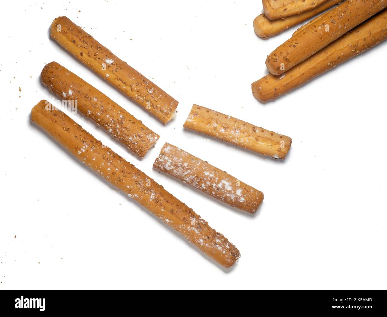 Sesame biscuits on a white background. Biscuits are elongated in the ...