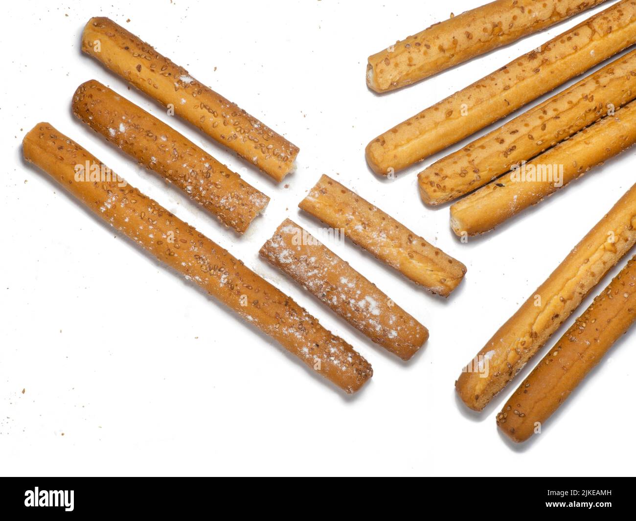 Sesame biscuits on a white background. Biscuits are elongated in the ...