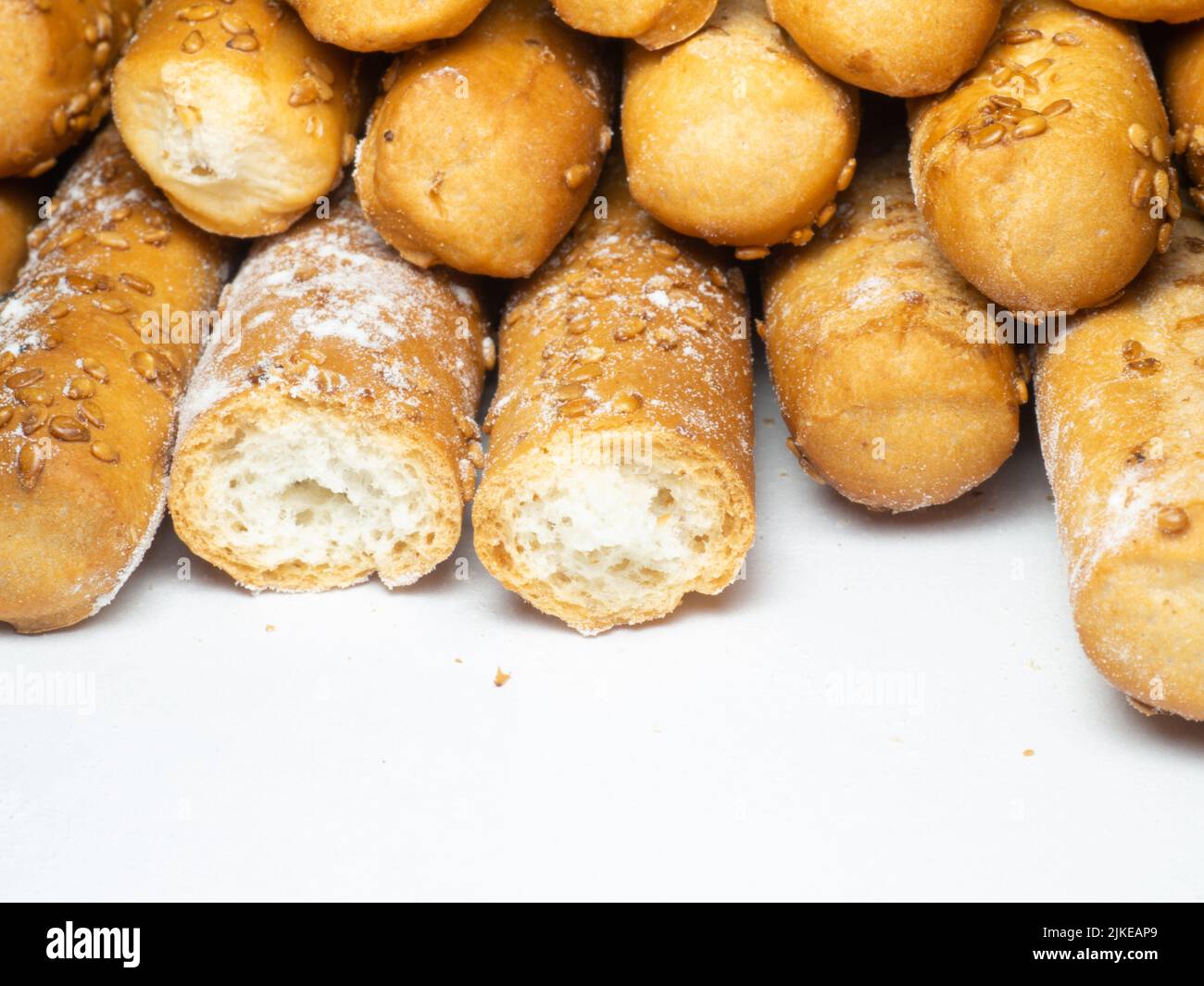 Sesame biscuits on a white background. Biscuits are elongated in the ...