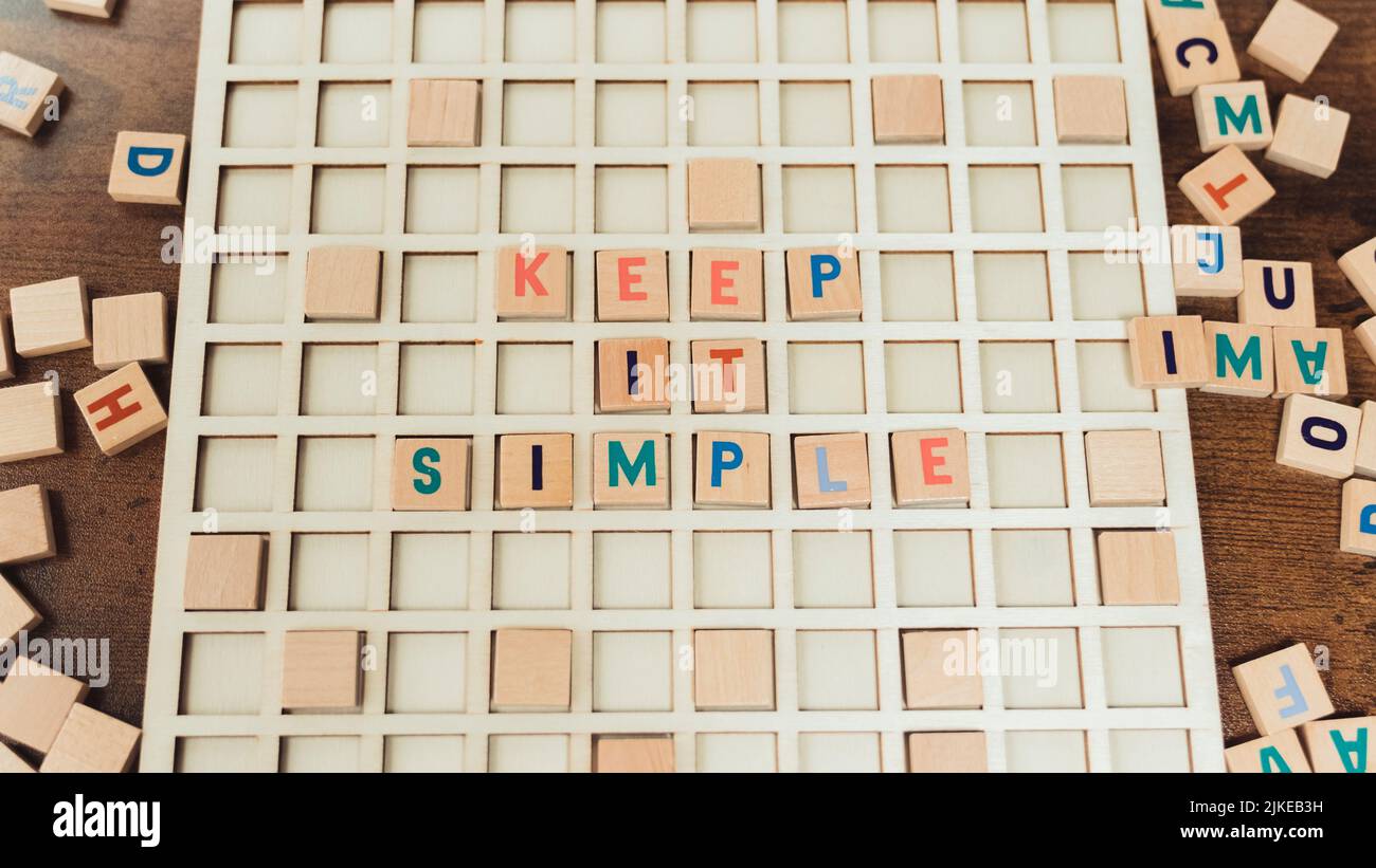 Keep it simple. Good advice concept. Colourful wooden square letters ...