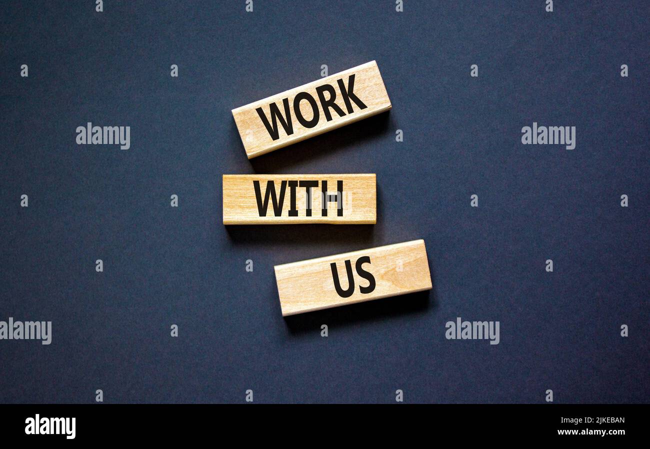 Work with us symbol. Concept words Work with us on wooden blocks on a ...