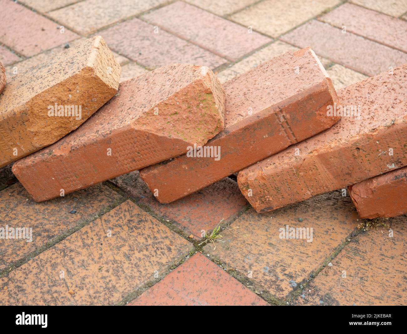 Old brickwork. Brick block. Demolition work. Stones on the ground ...