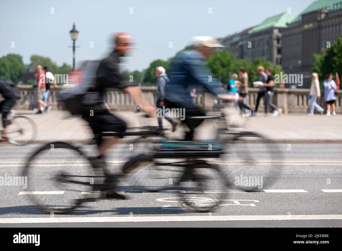 long exposure of cyclists on a bike lane Stock Photo - Alamy