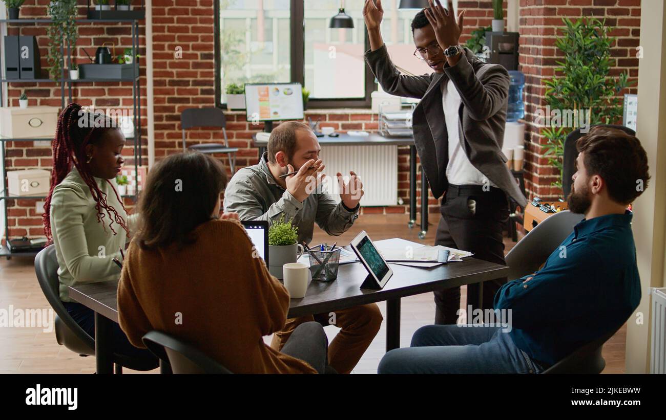 Angry frustrated boss throwing papers after team failure, having ...