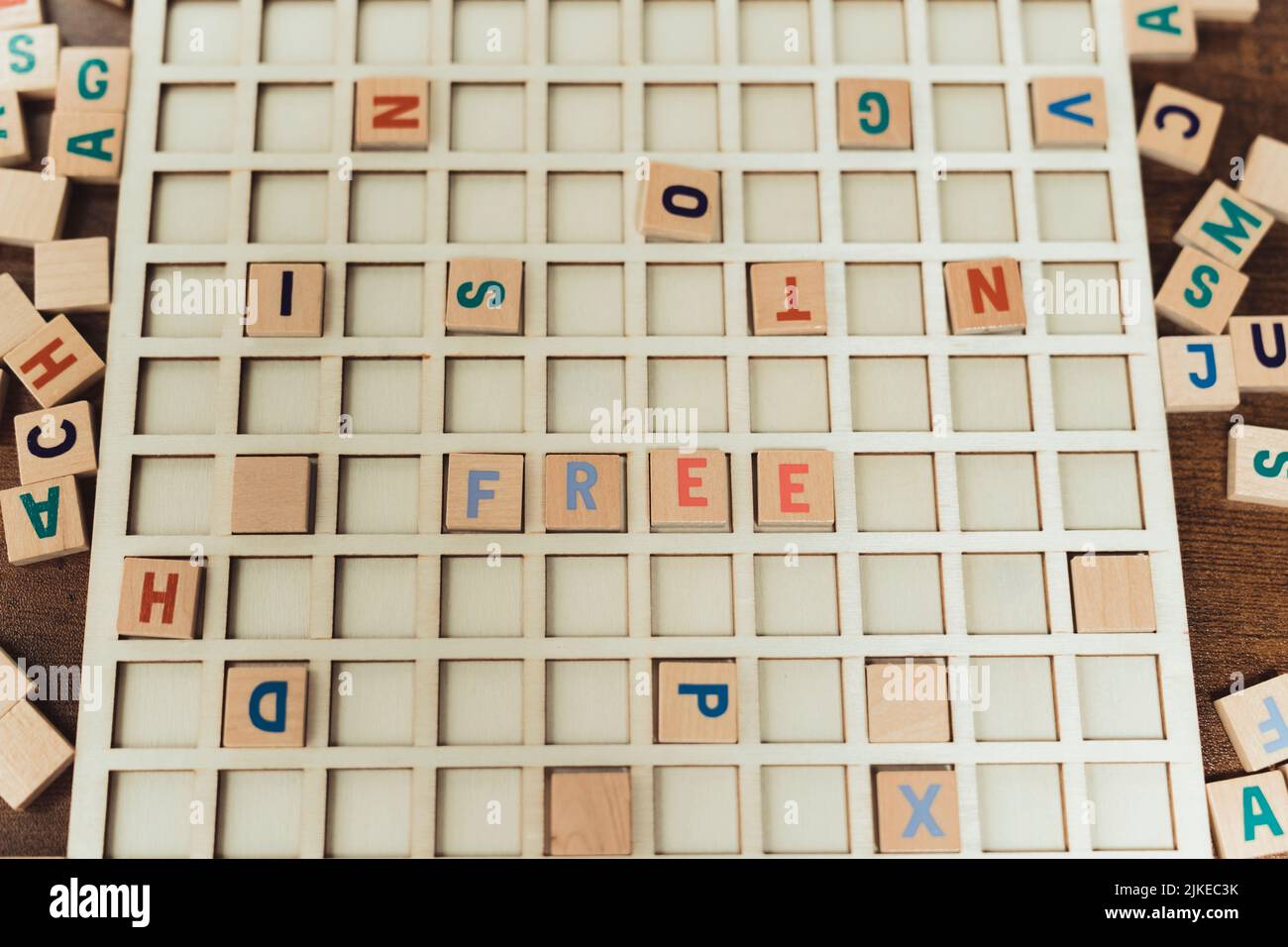 Advertisement concept. Various colourful letters on a board, two blue ...