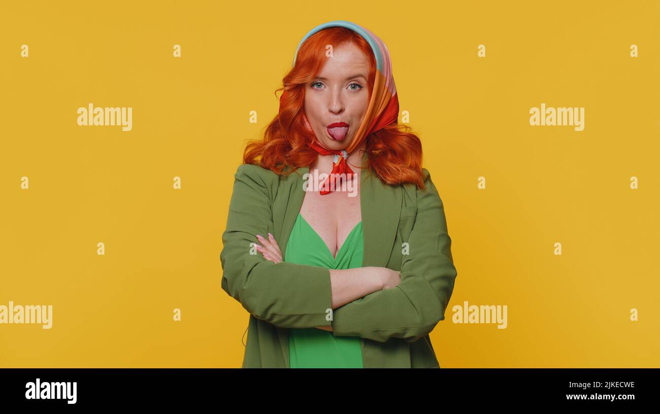 Funny joyful sincere redhead woman 20s in jacket making playful silly ...