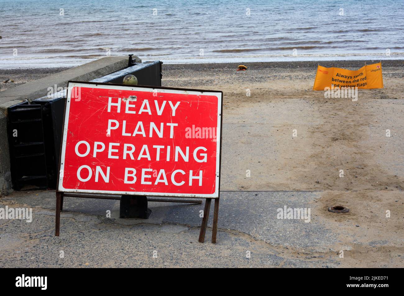 Heavy plant operations on beach sign hi-res stock photography and ...
